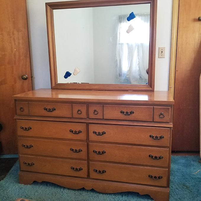 Grandma's dresser with mirror&mdash;where generations of Oklahomans checked their reflections before church, first dates, and job interviews. Solid wood, solid memories.