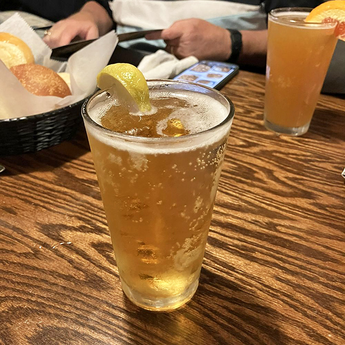 Cold drinks on a wooden table&mdash;because seafood without something refreshing is like Batman without Robin.