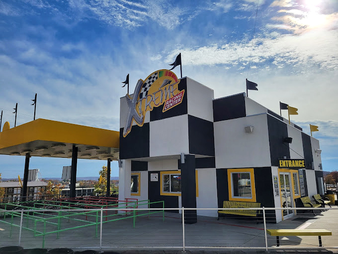 The checkered facade announces your arrival at speed paradise—like Disney World's entrance, but with more horsepower and less singing.