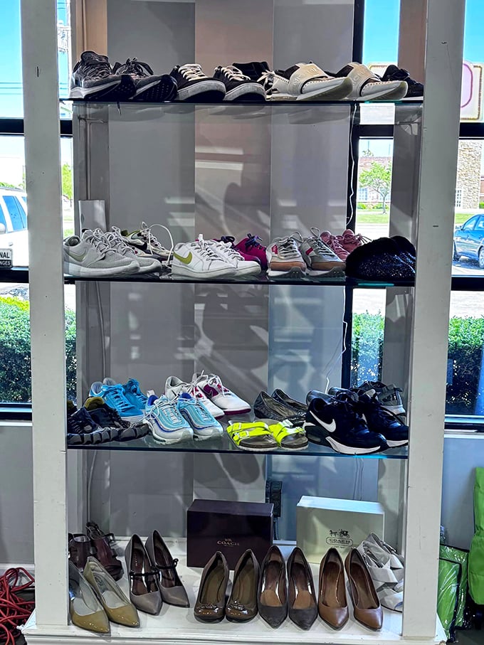 Designer heels and athletic sneakers cohabitate peacefully on these shelves, like a United Nations summit for footwear seeking second chances.