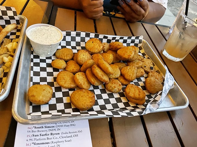 Golden-fried pickle medallions that crunch like autumn leaves, paired with creamy dipping sauce. The perfect opening act before the burger main event.
