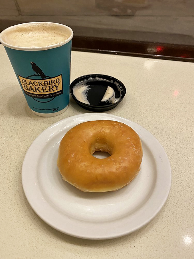 Simplicity perfected &ndash; a glazed donut and signature coffee. Some mornings don't need complexity, just this duo of comfort in Blackbird's distinctive blue.