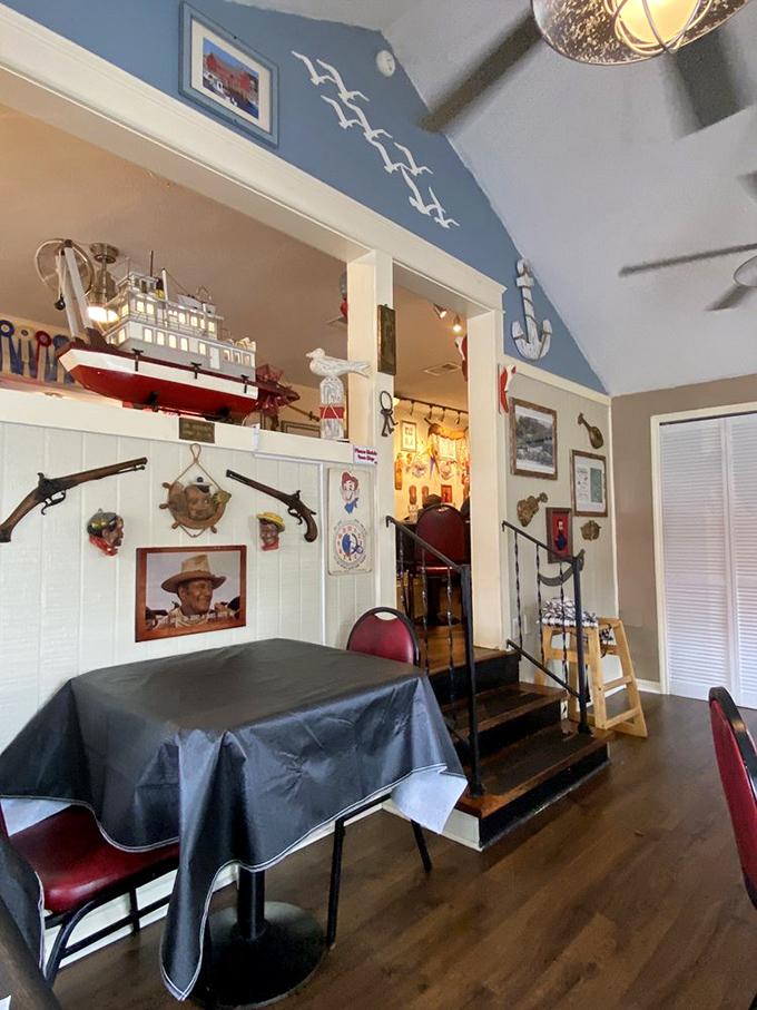 The multi-level dining room feels like you've boarded a quirky captain's vessel. That blue ceiling with flying seagulls? Pure Florida maritime magic.