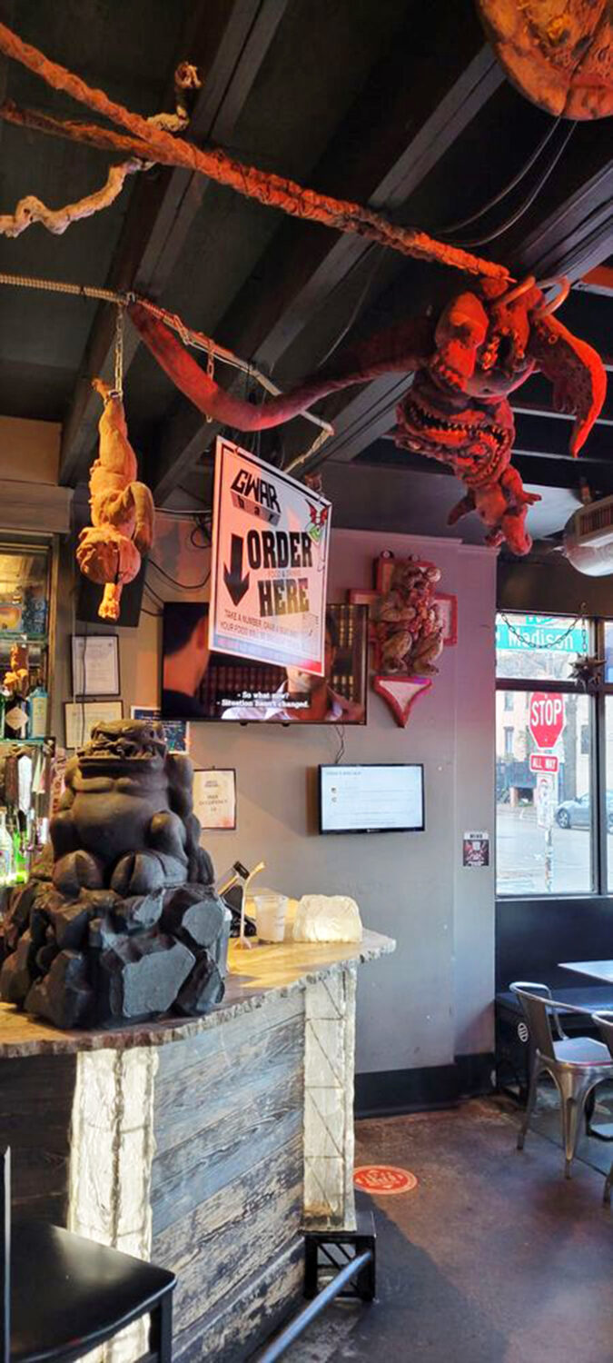 The monsters overhead seem to be saying, "Come for the decor, stay because we're blocking the exit."