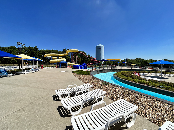 Lounge chairs await heat-exhausted parents who've earned their horizontal moments after applying sunscreen to wiggling children with octopus-like evasion skills.