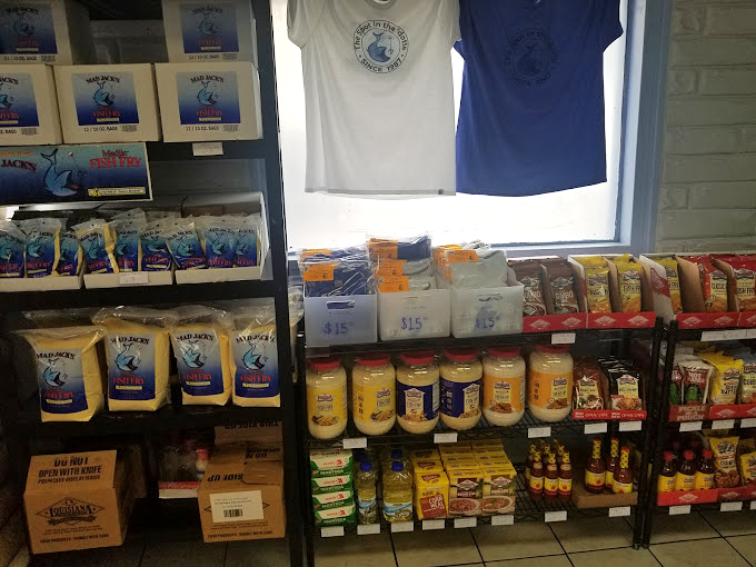 The merch wall says it all: this isn't just a restaurant; it's a community institution with enough loyal fans to warrant branded t-shirts.