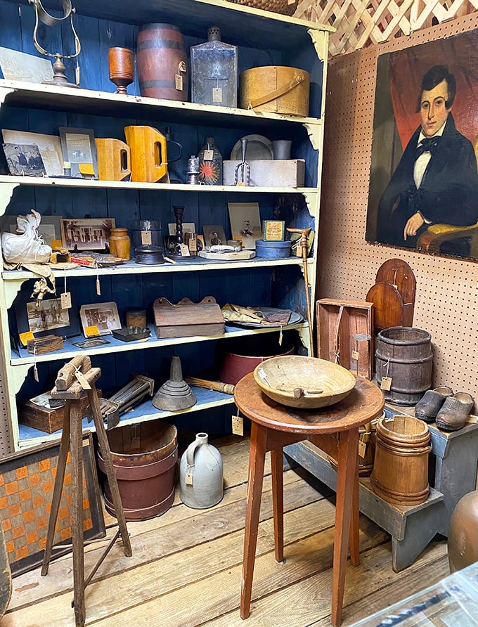Blue shelves against weathered wood&mdash;a museum of everyday life where humble objects become historical artifacts.