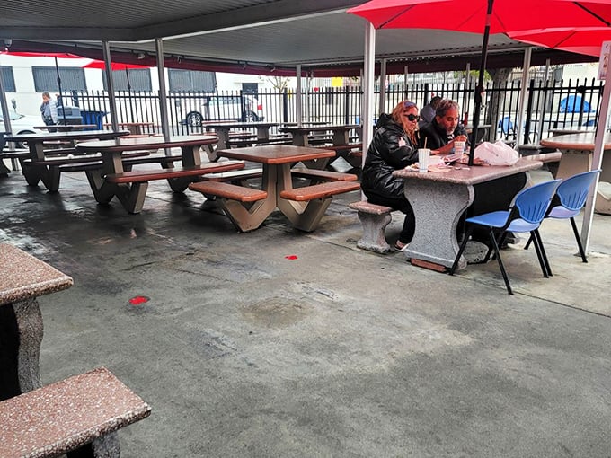 Al fresco dining, LA-style. Red umbrellas provide shade while concrete tables offer no pretense &ndash; just a place to focus entirely on your seafood.