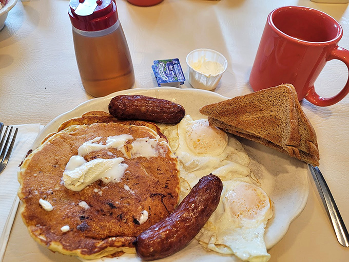 Pancakes so fluffy they could float away if not anchored by sausage links. This is the breakfast that breakfast dreams about at night.