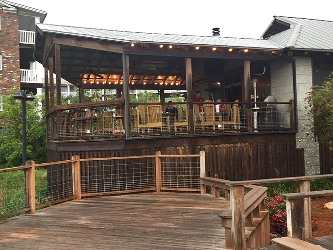 The covered deck where rocking chairs and ocean breezes conspire to make you cancel your afternoon plans.