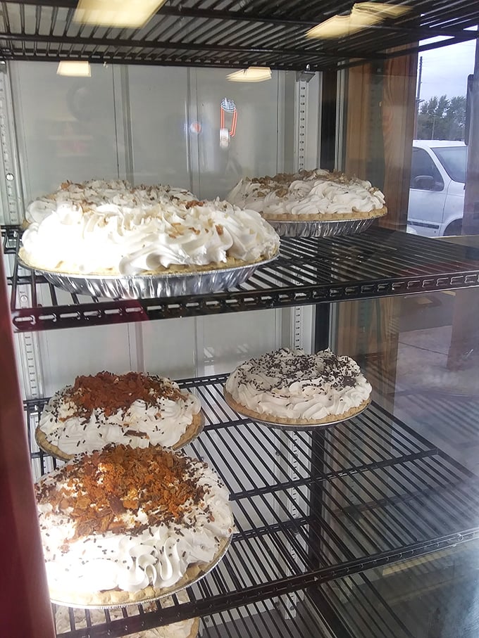 Cream pies with meringue so tall it needs FAA clearance. Each slice is basically a down payment on an afternoon nap.
