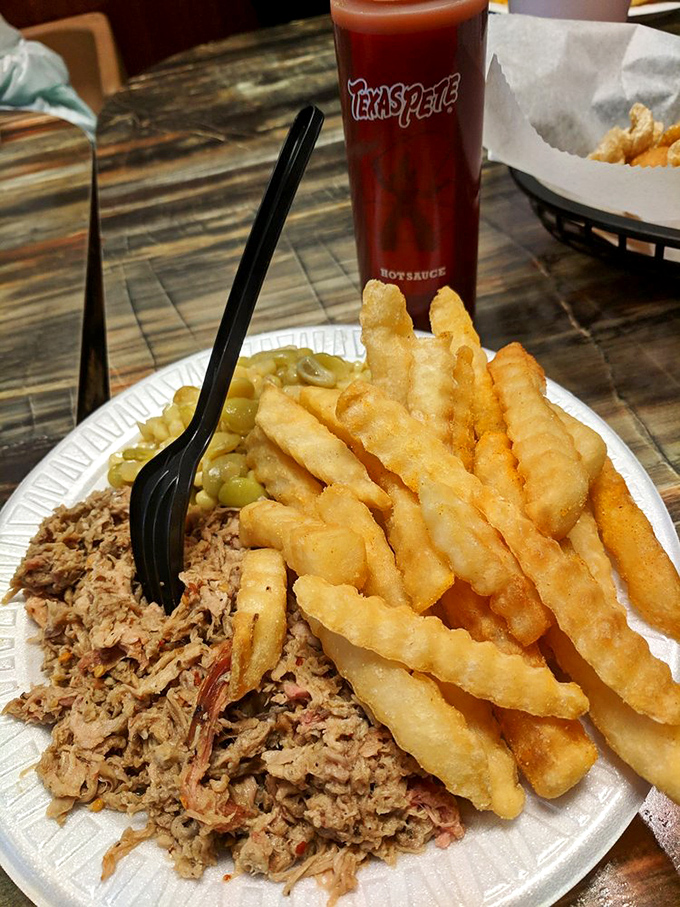 Pulled pork, French fries, and green beans—the holy trinity of Southern comfort that makes even the worst Monday feel manageable.