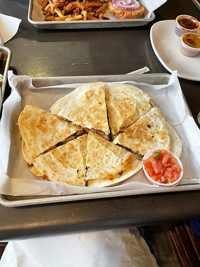 This quesadilla isn't messing around. Perfectly grilled, stuffed with goodness, and cut with mathematical precision that would make your geometry teacher proud.