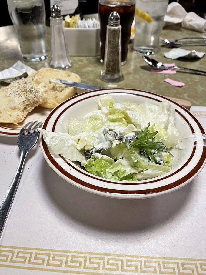 Johnny's salad bowl might look simple, but in a temple of meat, these crisp lettuce leaves perform the vital role of palate refresher.