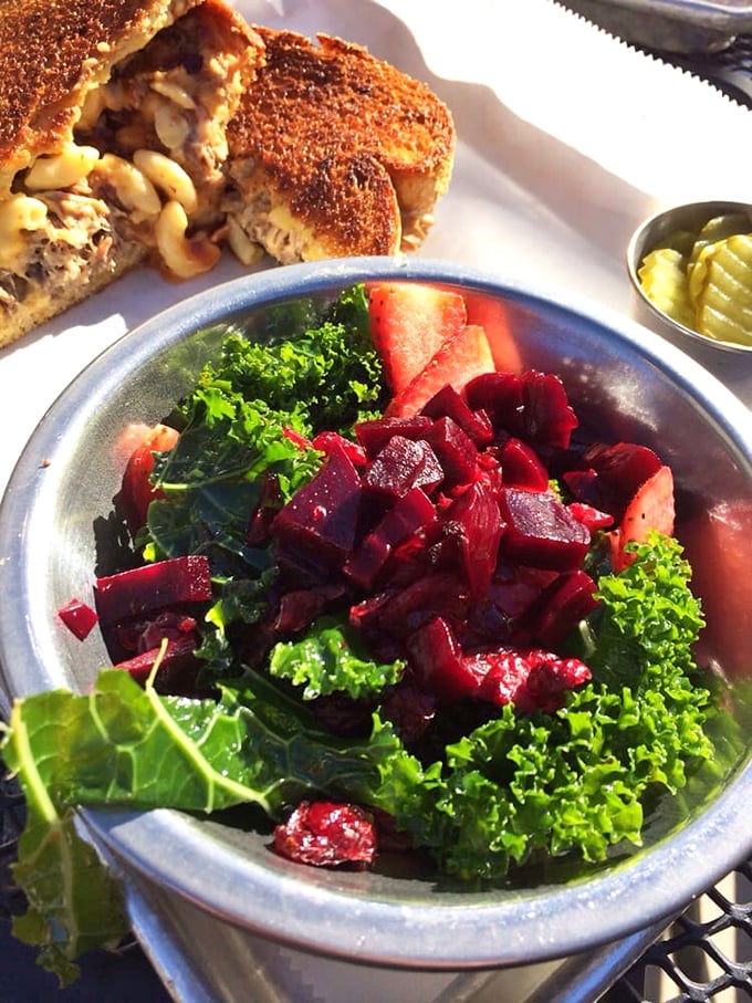 The interior reveals The Mule's industrial-meets-homey aesthetic. Wood, metal, and concrete create a space that feels both trendy and timeless&mdash;like comfort food itself. 