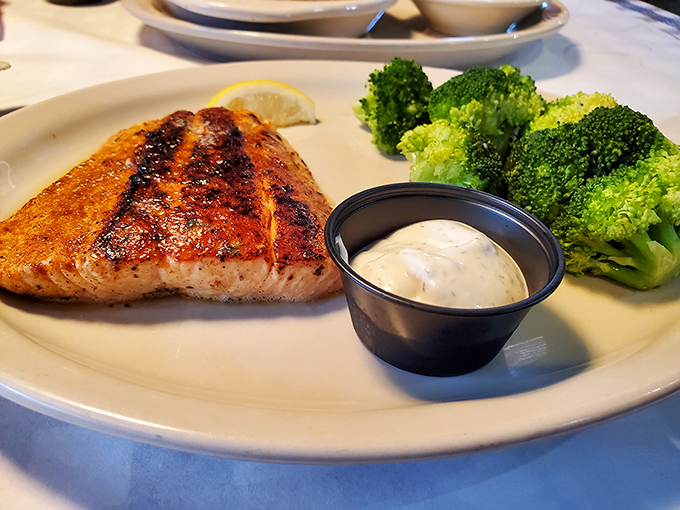 Eating salmon this perfectly grilled almost feels virtuous. The vibrant broccoli stands at attention, ready for its supporting role in a healthier indulgence.