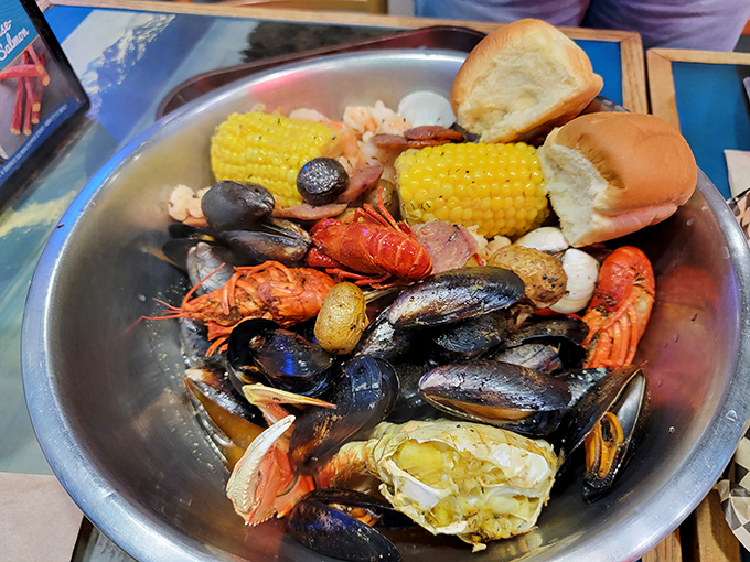 A seafood boil that's basically an underwater party in a bowl. The corn and bread are just there to soak up that magical broth.