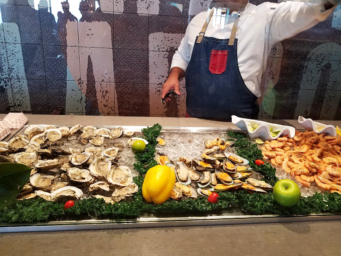 The holy trinity of seafood: oysters, clams, and shrimp on ice. This display is what seafood dreams are made of&mdash;fresh, abundant, and expertly presented.