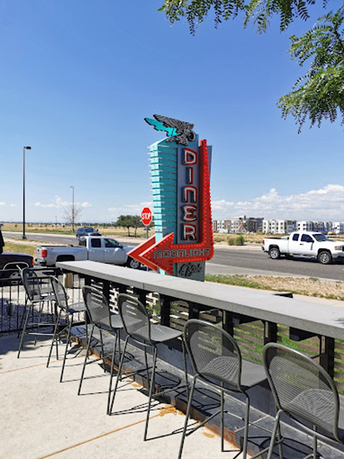 That neon sign doesn't just advertise a diner&mdash;it beckons like an old friend, promising refuge from airport chaos and highway monotony.