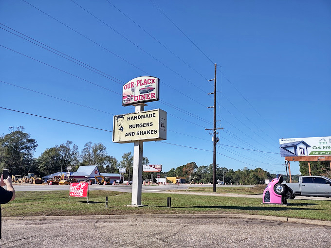 The roadside sign promises "handmade burgers and shakes"—two magic phrases that have caused many a car to swerve into the parking lot.