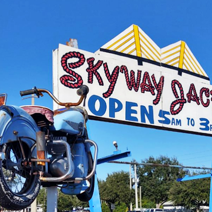 That vintage sign and motorcycle combo screams "authentic roadside America." Open 5am to 3pm because breakfast legends need their rest too.