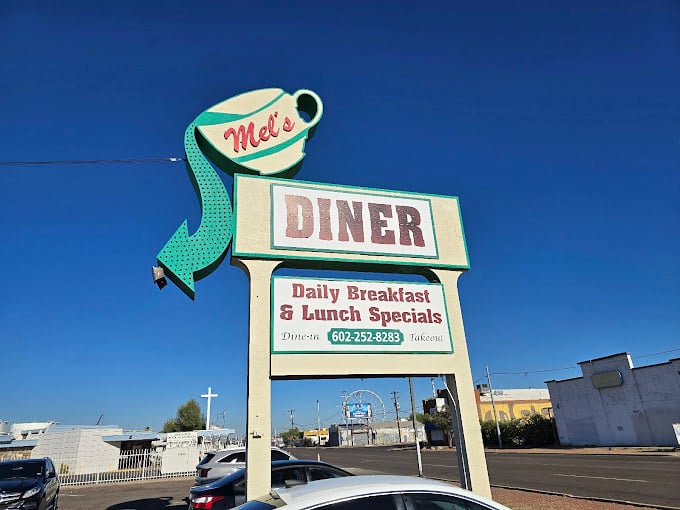 The iconic Mel's sign stands as a beacon of hope for the hungry, promising daily specials and the kind of hospitality that's becoming an endangered species.