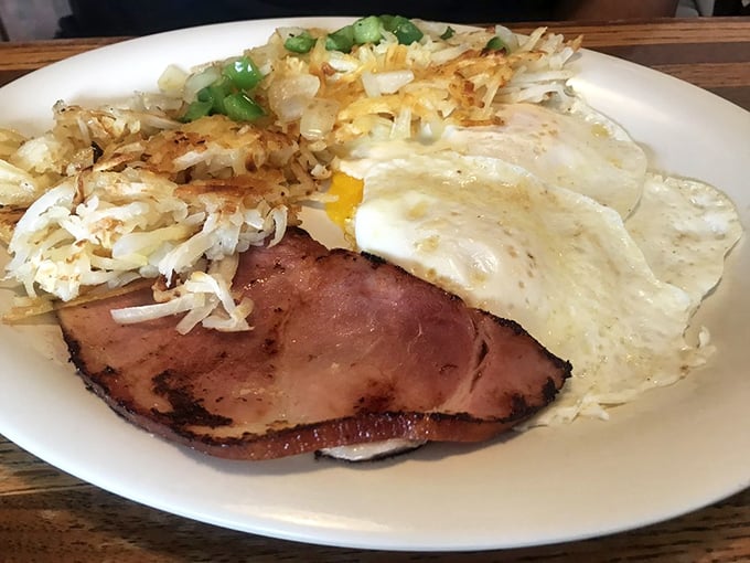 Country ham and eggs: a partnership more legendary than Lennon and McCartney. Those crispy-edged hash browns are the George Harrison.