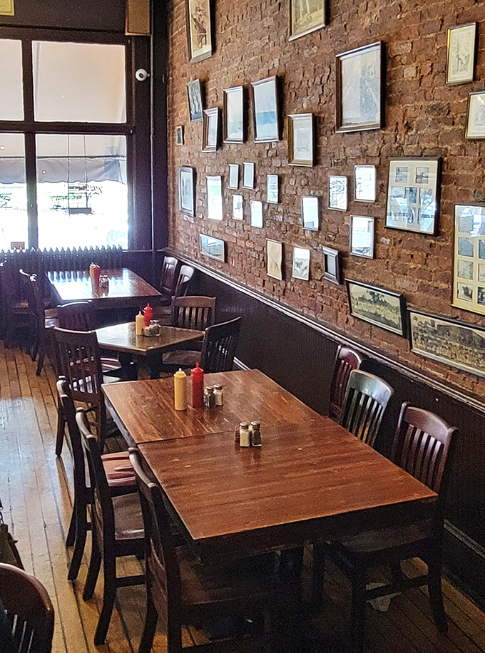 Simple wooden tables set with the essentials—ketchup, mustard, and enough space for plates piled high with comfort food that speaks a universal language.