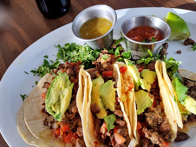 Tacos arranged like a delicious color wheel, with avocado adding creamy contrast to the savory meat &ndash; proof that beauty can be delicious.