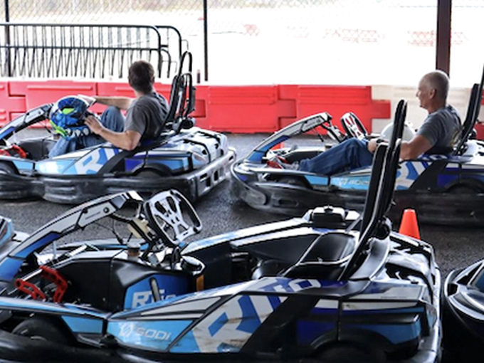 Racers in their natural habitat, sizing up the competition while pretending they're just here for fun. We see through you, gentlemen.