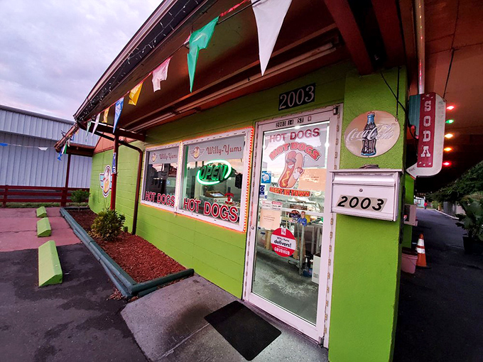 Willy-Yums' electric lime green exterior announces itself with all the subtlety of a neon billboard &ndash; this place takes hot dogs seriously.