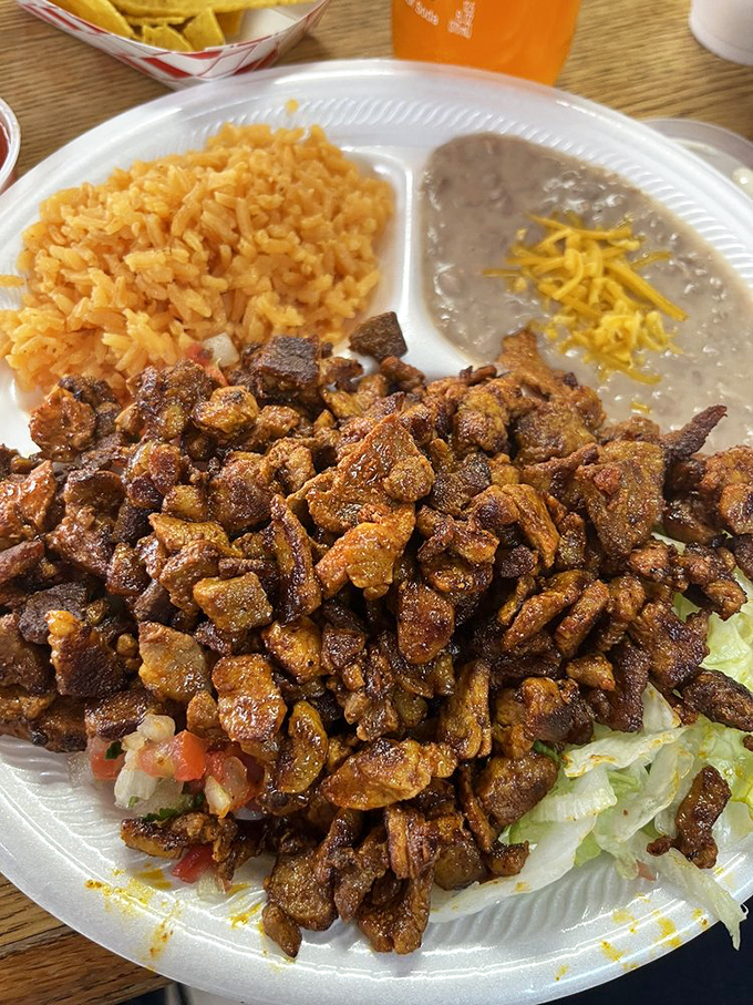 The adobada plate brings the fiesta with its vibrant colors and bold flavors that dance across your taste buds.
