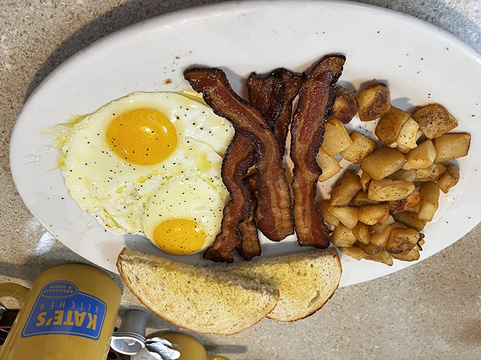 The breakfast trinity&mdash;crispy bacon, sunny eggs, and golden potatoes with toast standing by for yolk-sopping duty. Morning salvation on a plate.