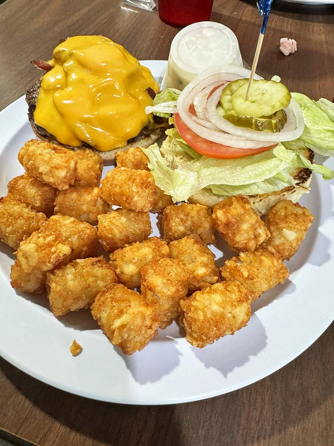 This isn't just a cheeseburger with tots&mdash;it's proof that Hole In The Wall knows comfort food extends well beyond breakfast hours.