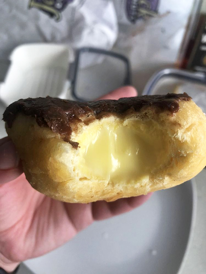 Cut into this Bavarian cream donut and witness the miracle—golden exterior giving way to creamy center. Like striking delicious oil.