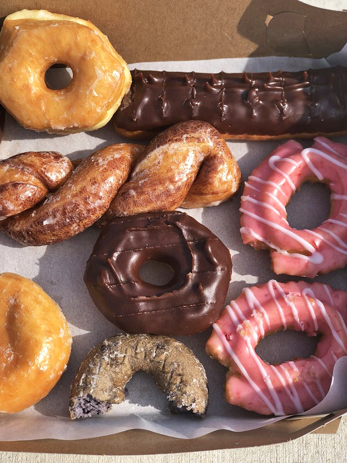 A donut box that promises happiness in every corner. The kind of spread that makes Monday mornings bearable again.