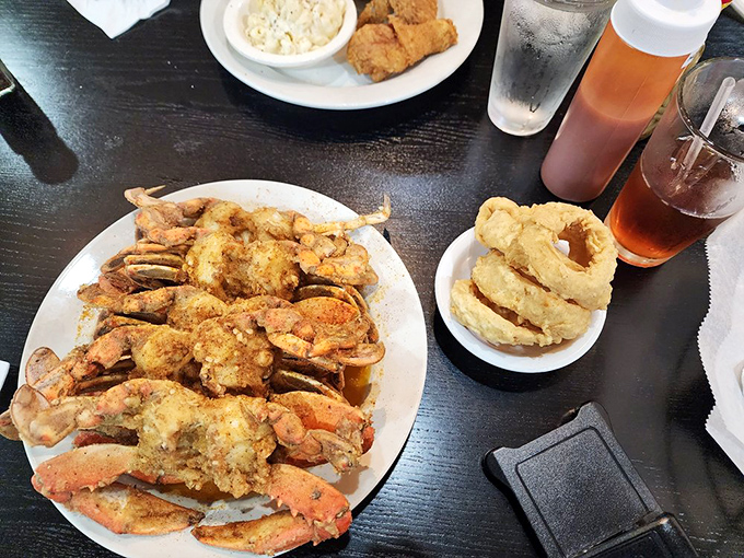 Blue crabs fried to golden perfection with onion rings on the side. The kind of seafood feast that justifies the inevitable shell fragments under your fingernails.