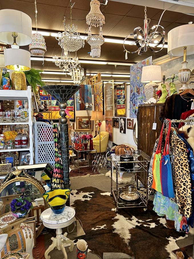 A booth where chandeliers hang like crystalline jellyfish, illuminating a sea of mid-century treasures below.