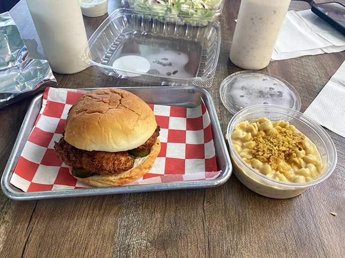Mac and cheese beside a chicken sandwich – because sometimes adults deserve to eat like kings with the palate of their inner child.