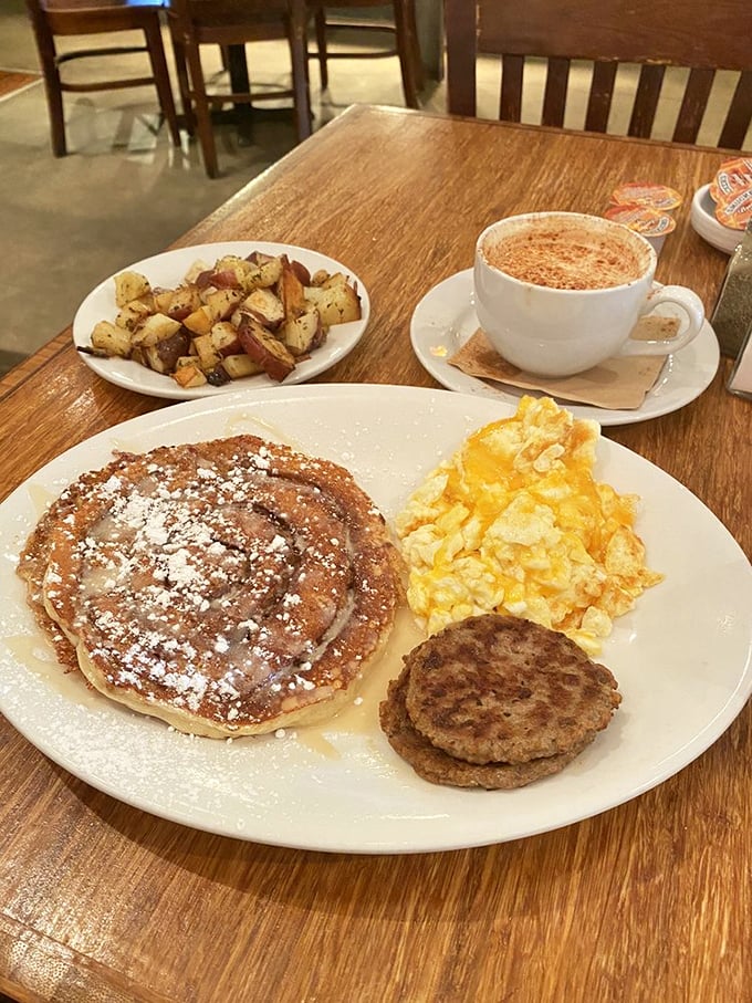 A breakfast spread that makes you want to invite everyone you know. Those pancakes are wearing powdered sugar like they're dressed for a special occasion.