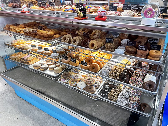 The display case of champions, where each shelf tells a different sugar-dusted story. Decision paralysis has never been so delicious.