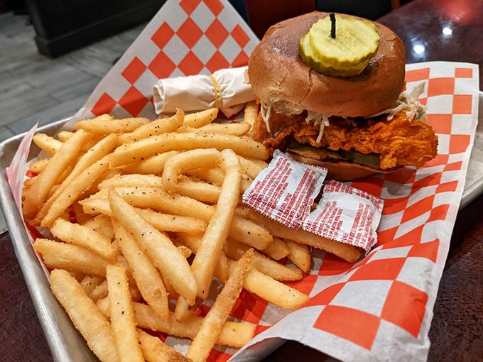 The artistic chalkboard menu breaks down the hot chicken sandwich architecture&mdash;a visual blueprint for the flavor construction that awaits.