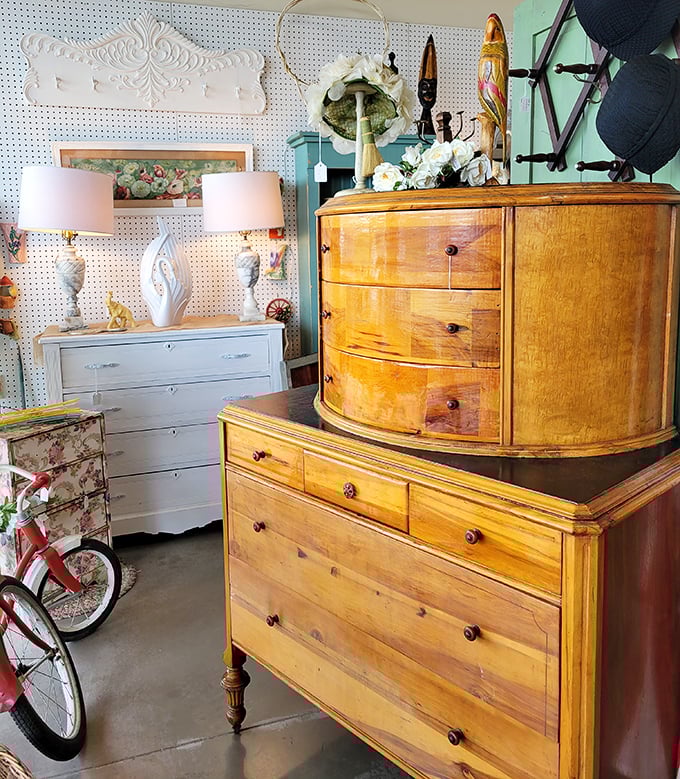 Blonde wood dressers with the warm patina of decades. That curved front drawer isn't just storage&mdash;it's architectural swagger from another era.