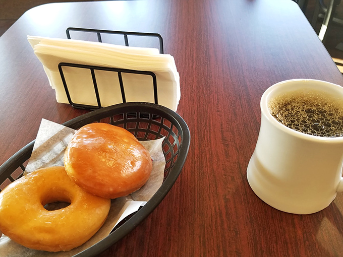Two glazed donuts and black coffee: the breakfast equivalent of a perfectly tailored suit—classic, reliable, and always in style.