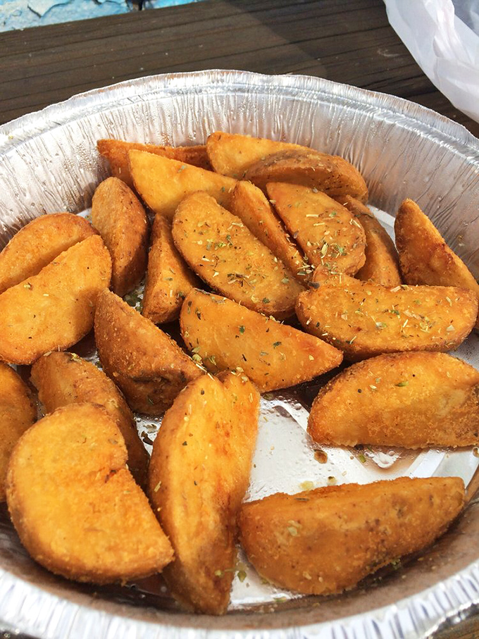 These aren't just fries&mdash;they're potato wedges that went to finishing school in Athens. The seasoning is their graduation cap.