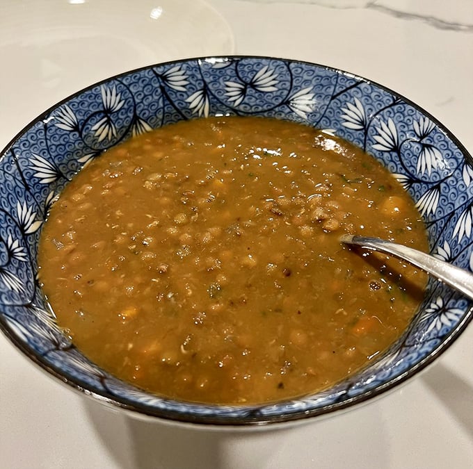 This lentil soup looks like liquid comfort in a beautiful blue bowl, ready to warm you from the inside out.