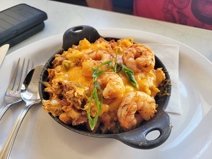 A skillet that could solve international conflicts. Those shrimp nestled among cheesy goodness make a compelling argument for world peace through breakfast.