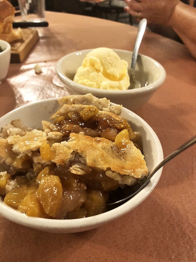Peach cobbler that makes you understand why the Georgia Peach song exists &ndash; sweet, warm, and worth saving room for despite your better judgment.