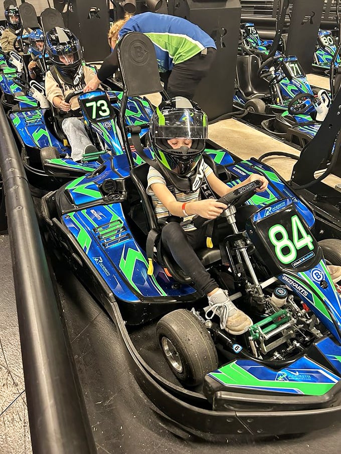 Staff members ensure young racers are properly secured&mdash;safety harnesses now, therapy for speed addiction later.