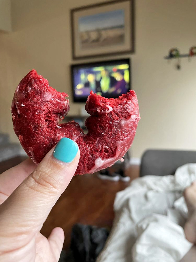 Red velvet donut with a bite missing&mdash;evidence that willpower has its limits. Even the strongest resolve crumbles before crimson perfection.